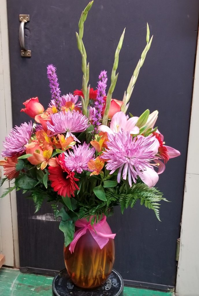 Large vase, mix of standard and novelty flowers. Photos are examples ...